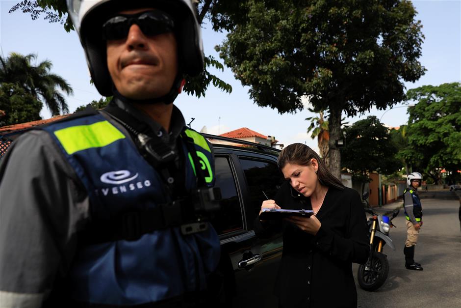 Motorists in crime-ridden Caracas seek safety through ‘Buddy’ app | The ...