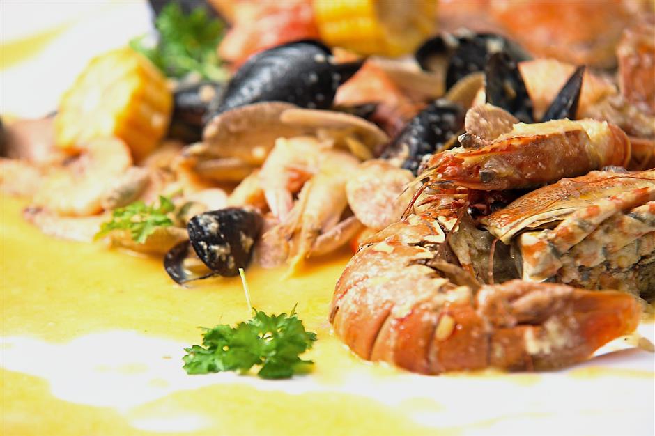 Cutlery optional when enjoying Cajun seafood at Ombak Kitchen | The Star