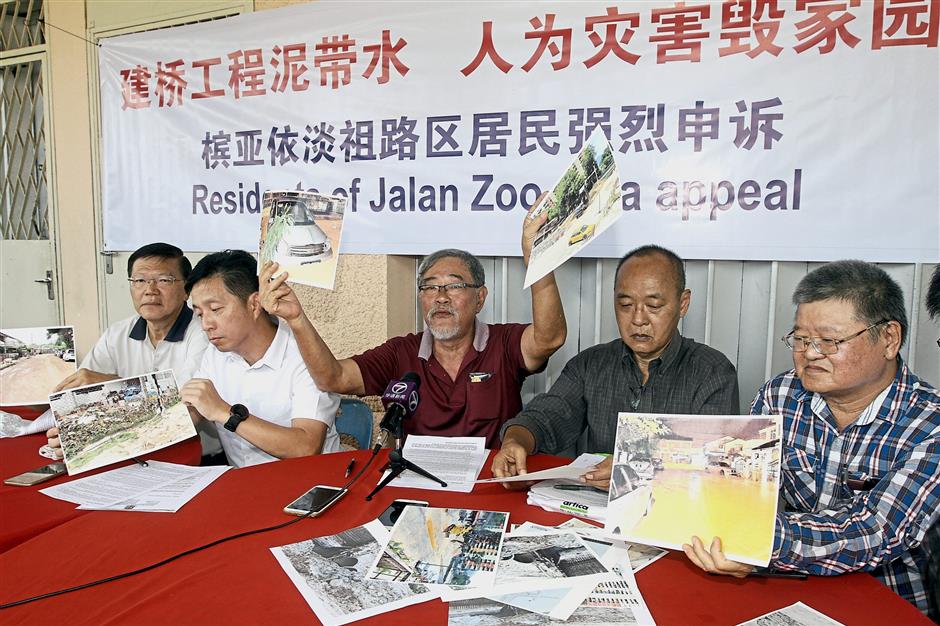 Air Itam residents say debris from bridge led to flooding | The Star