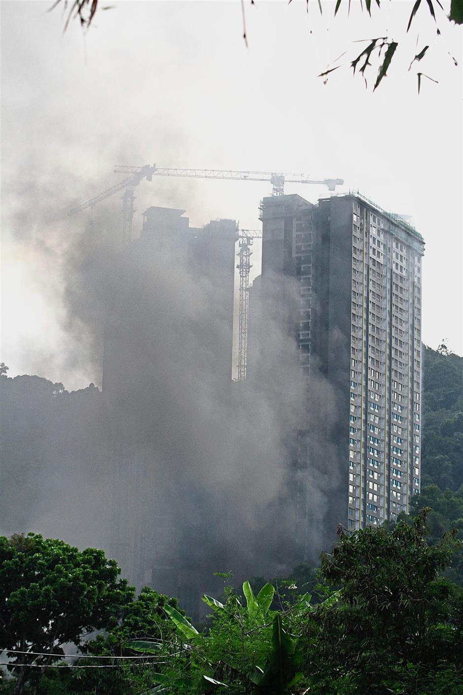 Fire traps seven workers at high-rise project | The Star